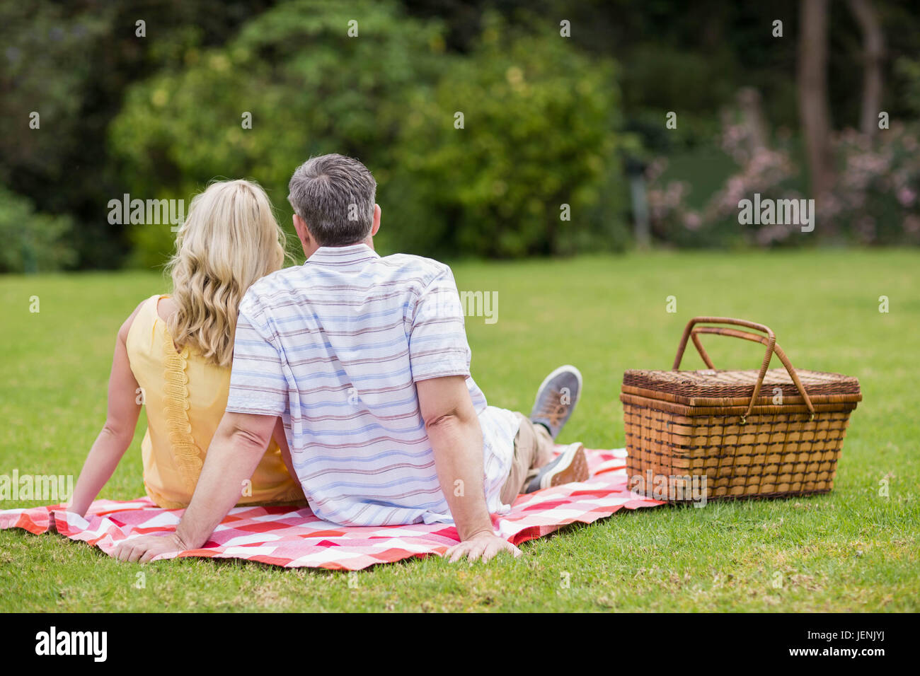 Cute couple having a picnic Stock Photo - Alamy