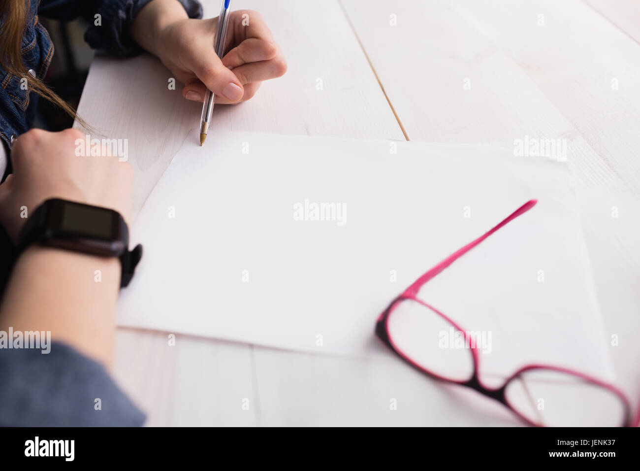 Businesswoman writing on sheet hi-res stock photography and images - Alamy