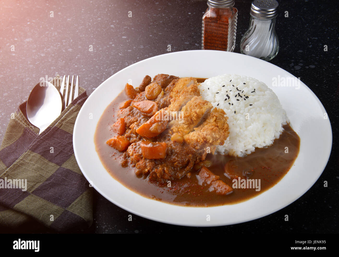Rice with deep fried pork and curry in Japanese style or katsu kare in ...