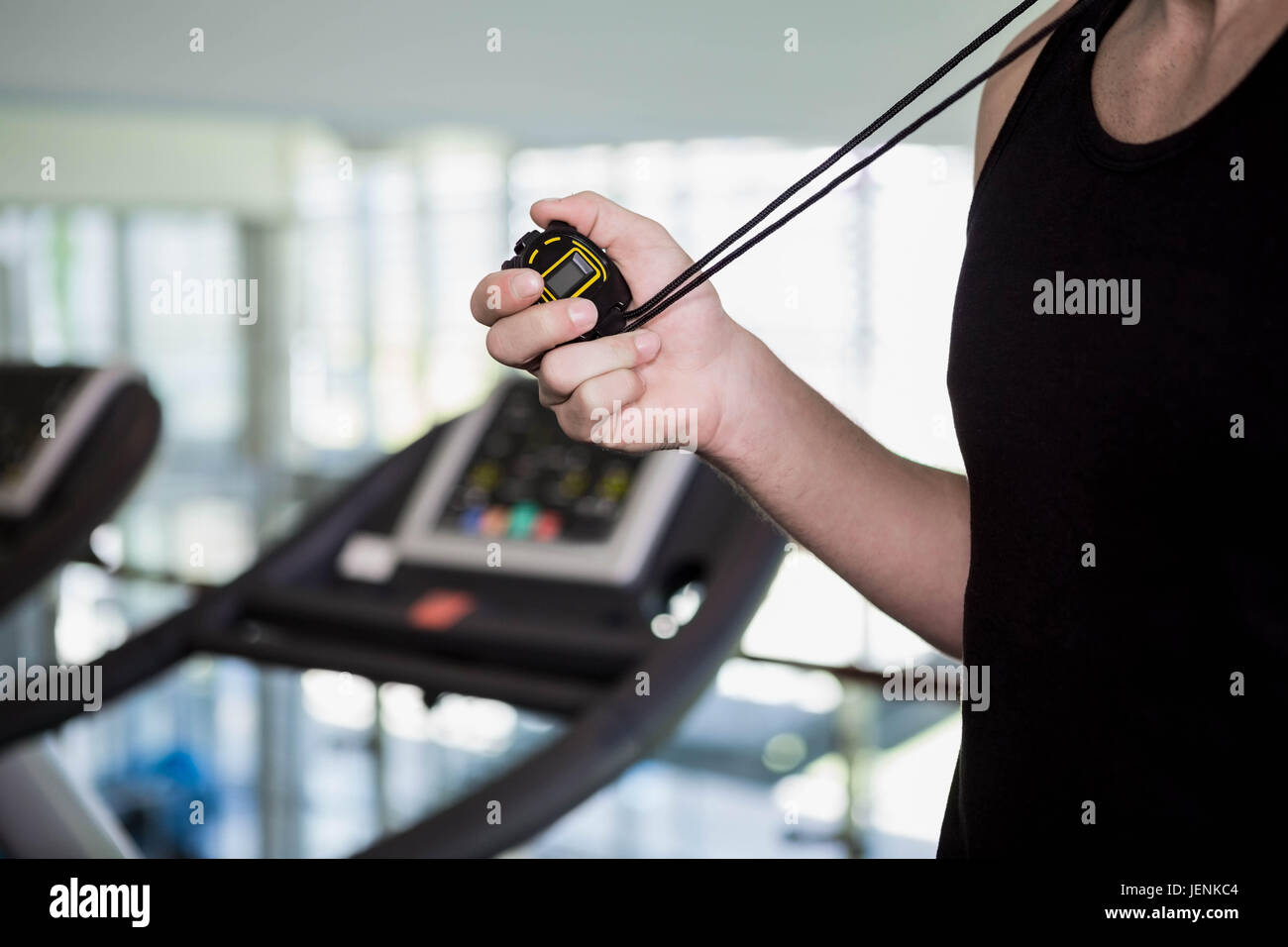 Man holding stopwatch hi-res stock photography and images - Alamy