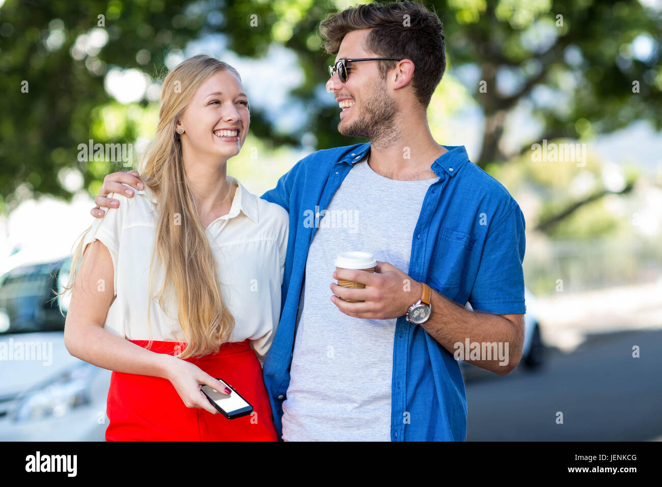 Hip couple laughing together Stock Photo - Alamy