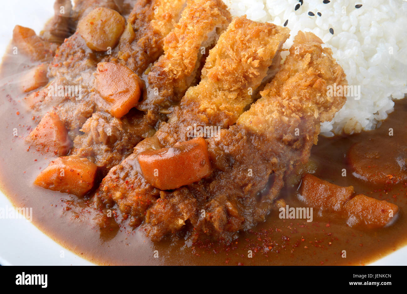 Rice with deep fried pork and curry in Japanese style or katsu kare in ...