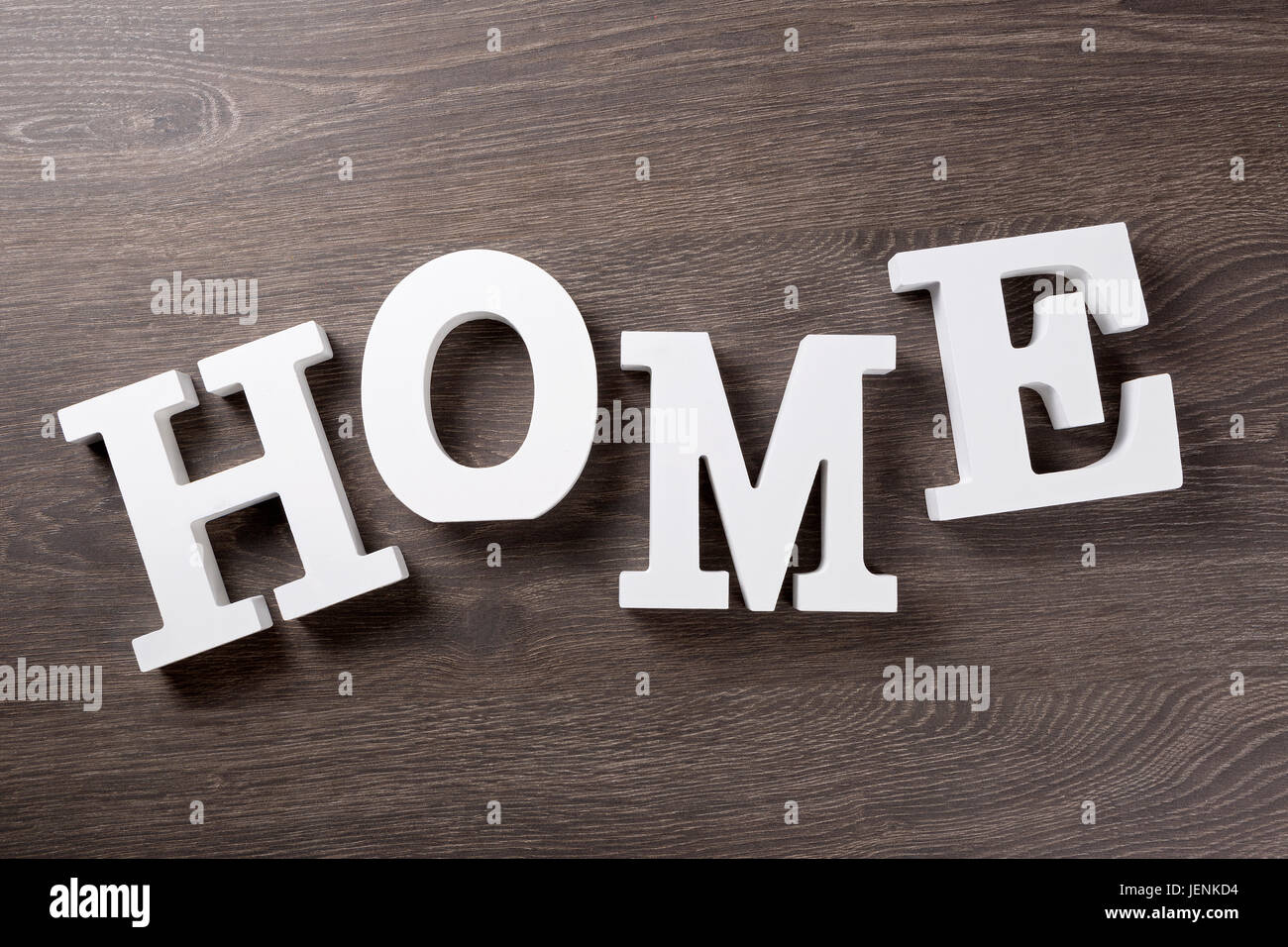 Home, written in letters, top view on a wooden background Stock Photo ...