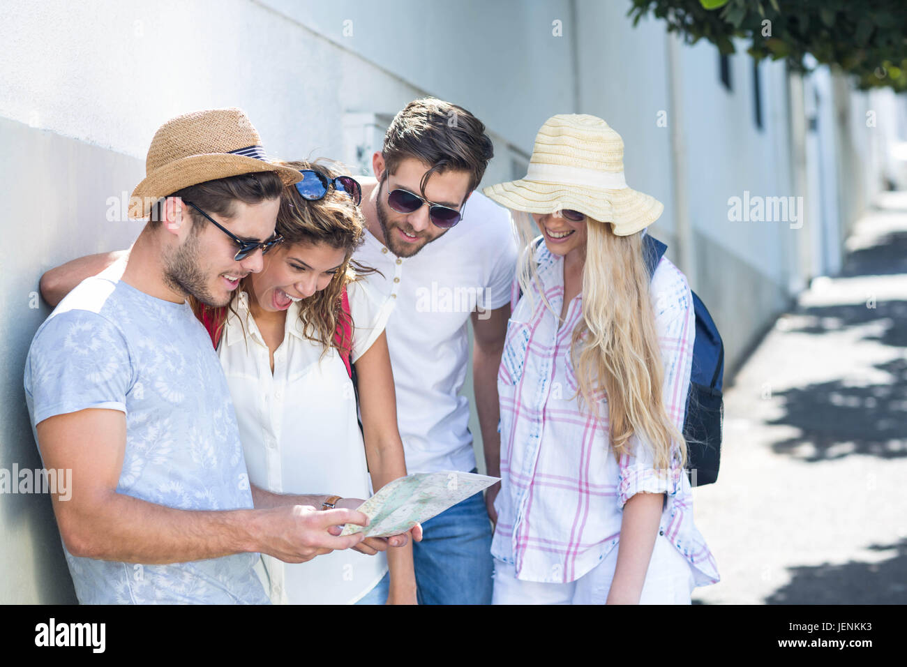 Female tourist checking map hi-res stock photography and images - Alamy
