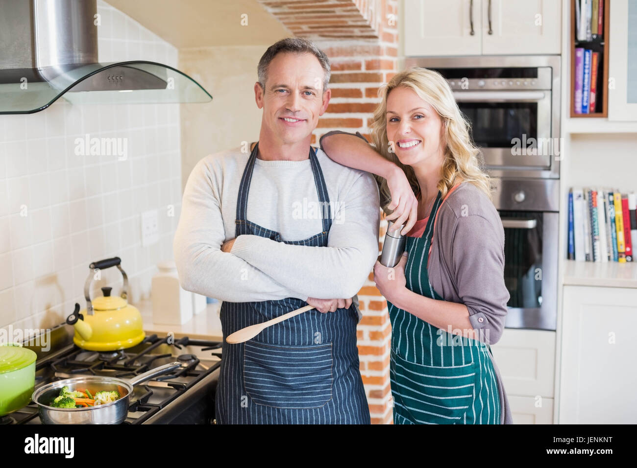 Cute couple cooking Stock Photo - Alamy
