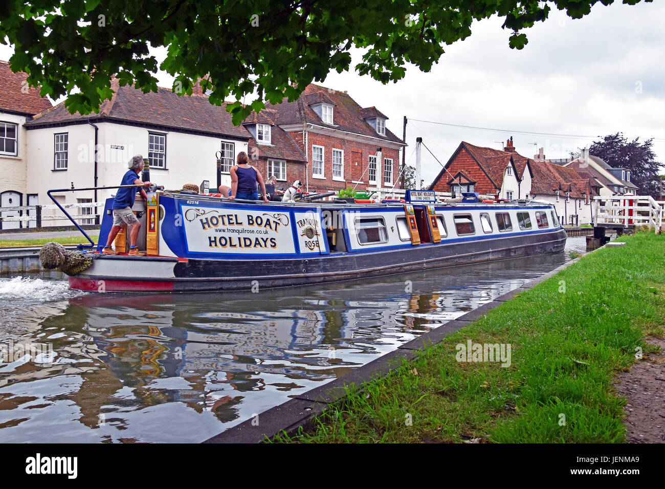 Narrowboat going through a swing bridge on Kennet and Avon canal in ...