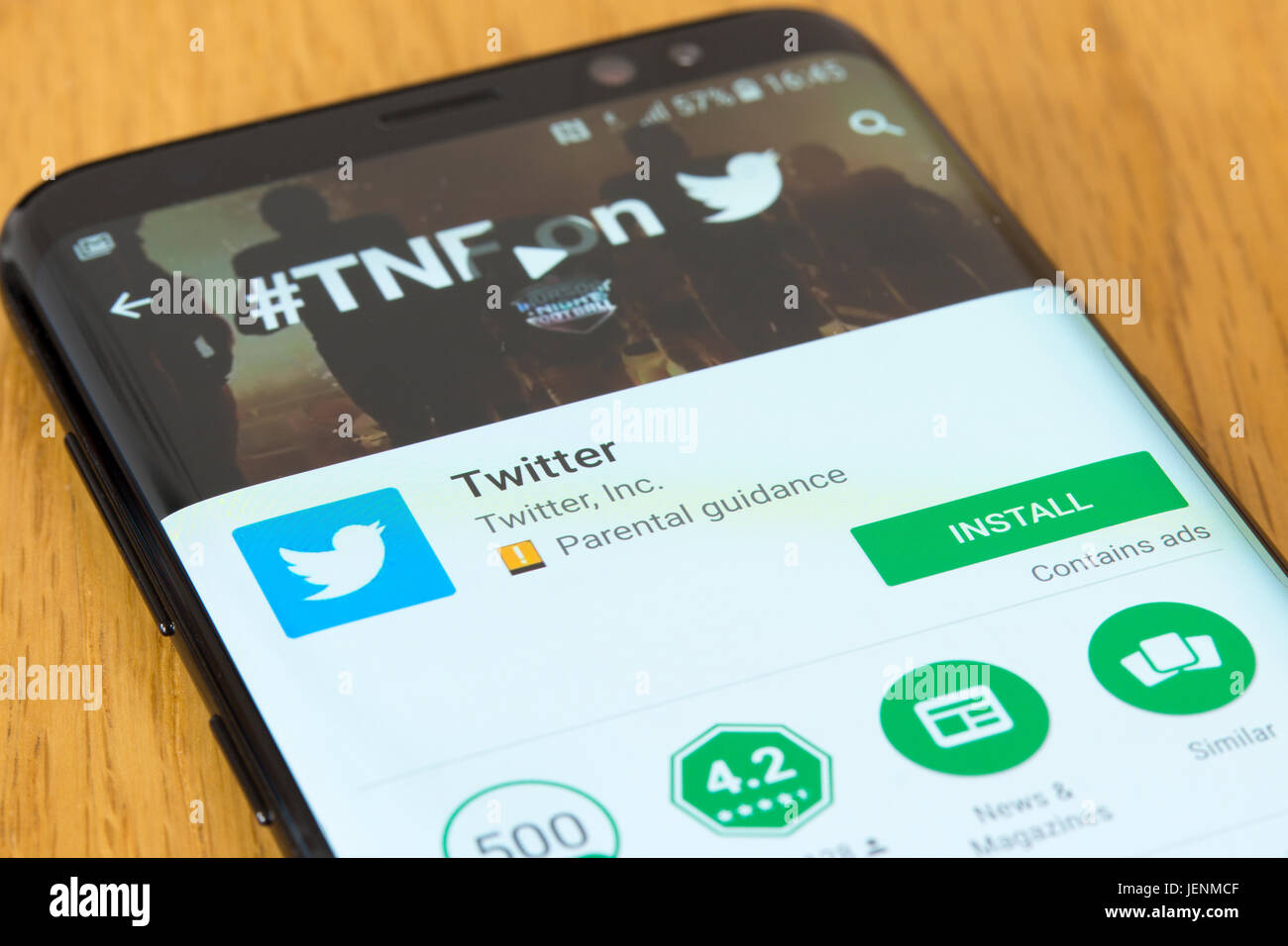 A closeup on the Twitter app install screen on a smartphone Stock Photo ...