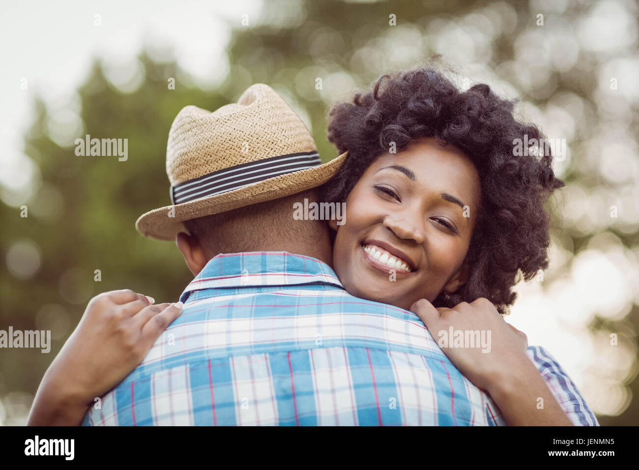 Happy couple embracing Stock Photo - Alamy