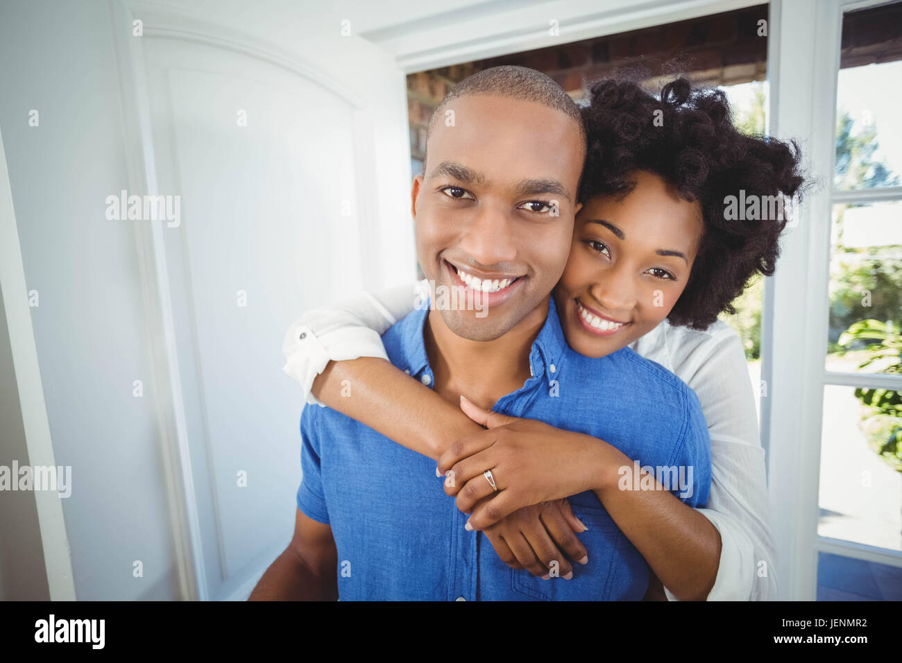 Happy couple holding box Stock Photo - Alamy