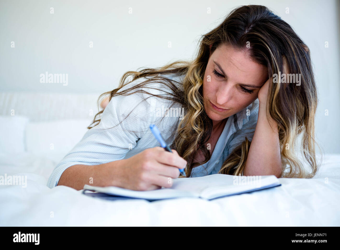 Sad Girl Writing In Diary
