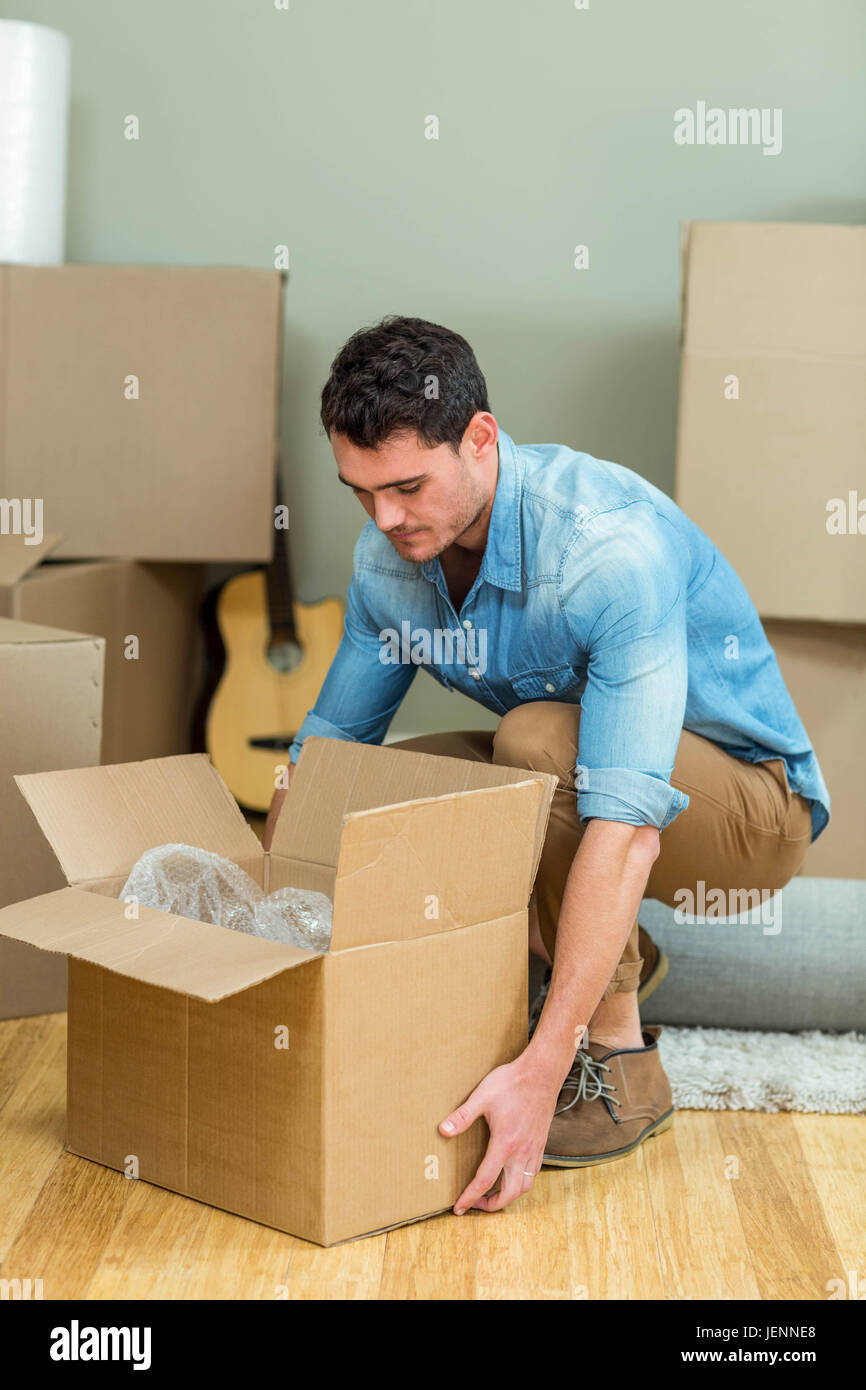 Young man carrying carton boxes Stock Photo - Alamy