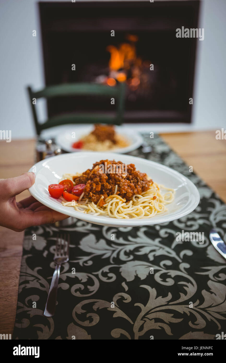 Woman putting plate pasta hi-res stock photography and images - Alamy