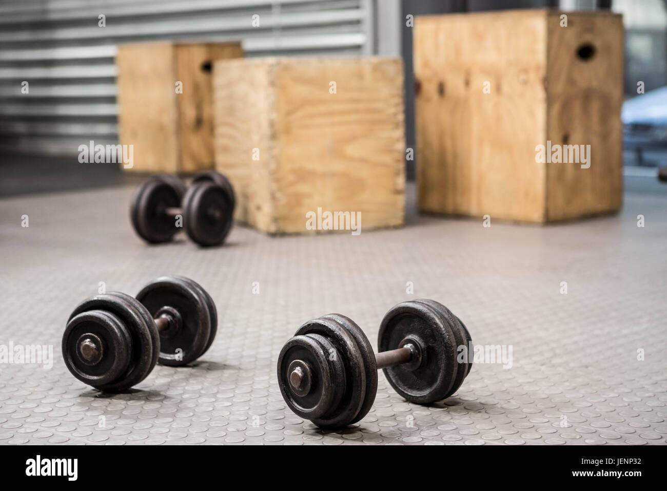 Dumbbells on the floor Stock Photo - Alamy
