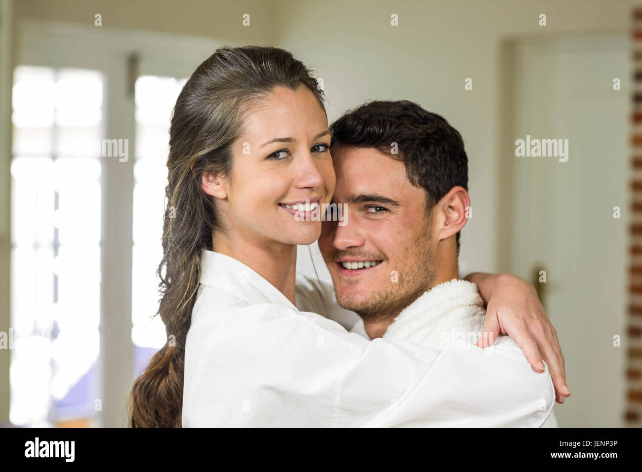 Cute couple embracing Stock Photo - Alamy