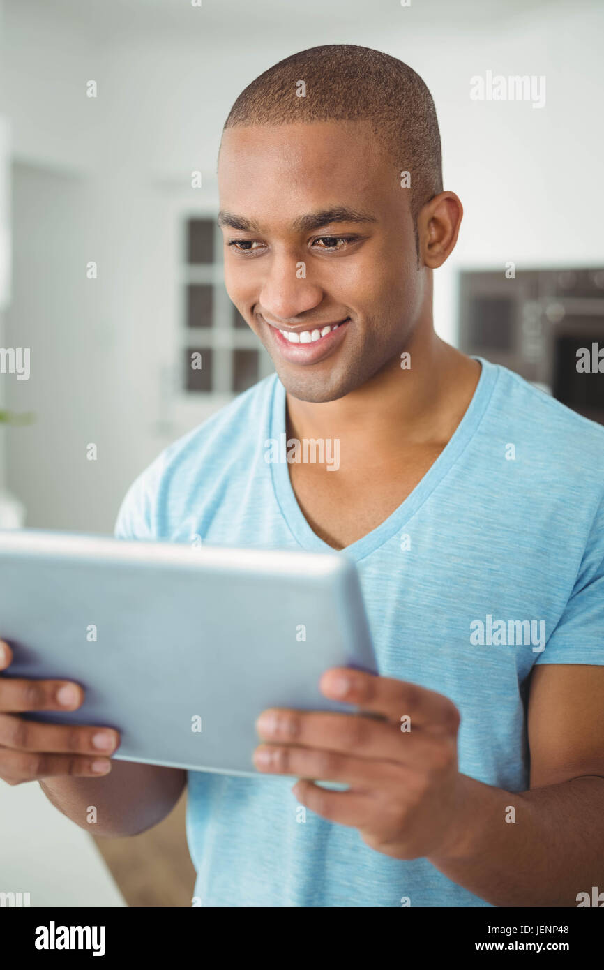 Handsome man using tablet Stock Photo - Alamy