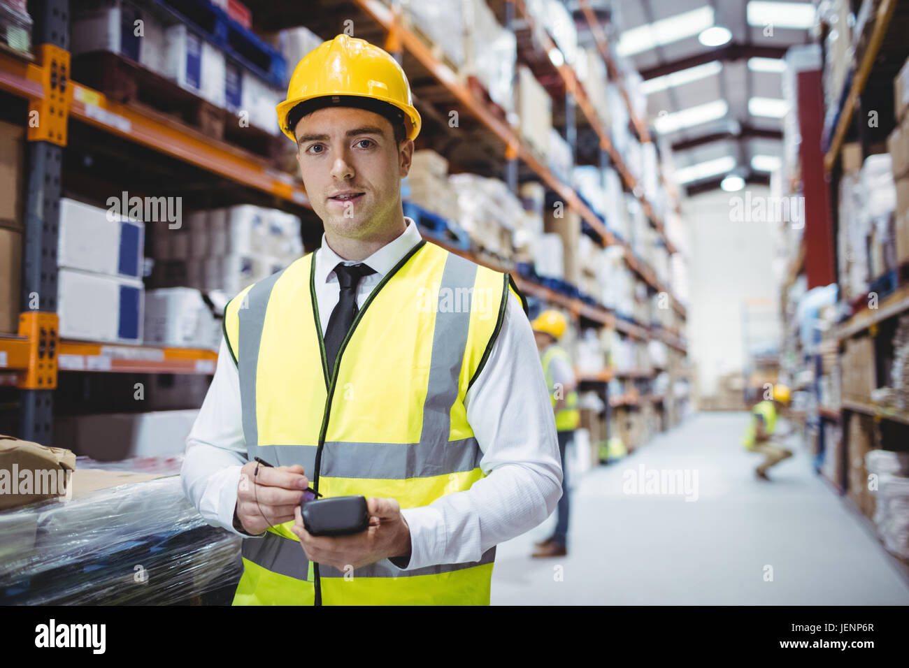 Portrait of smiling warehouse manager Stock Photo - Alamy