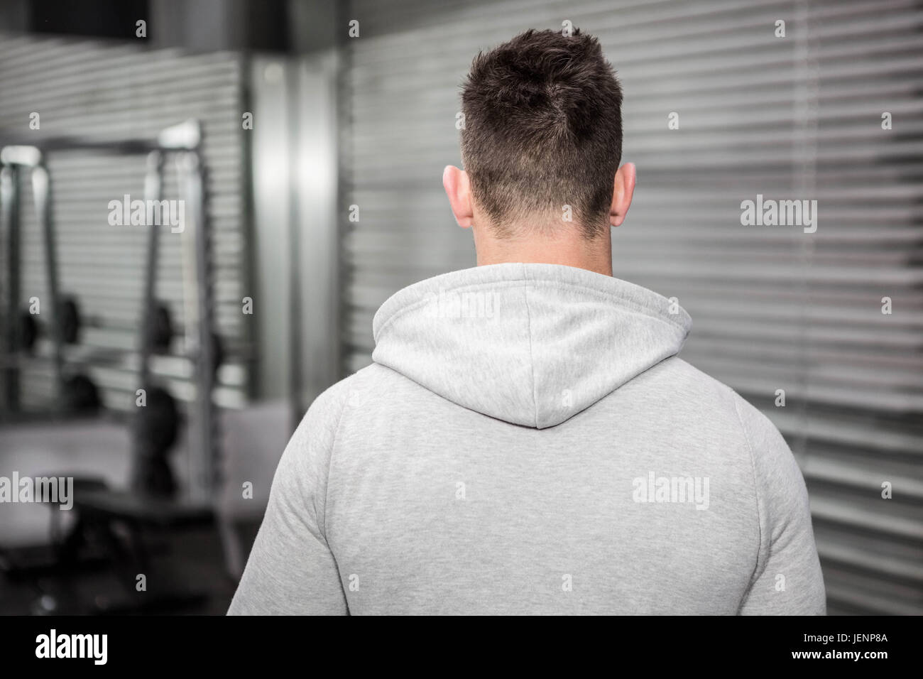 Rear view of man with grey jumper Stock Photo - Alamy