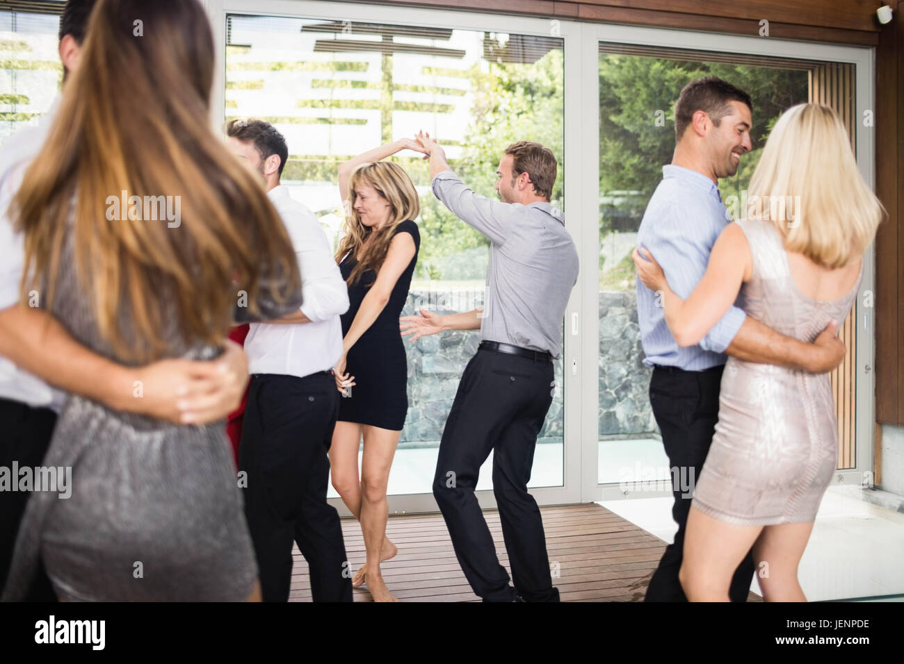 Group of young friends dancing Stock Photo - Alamy