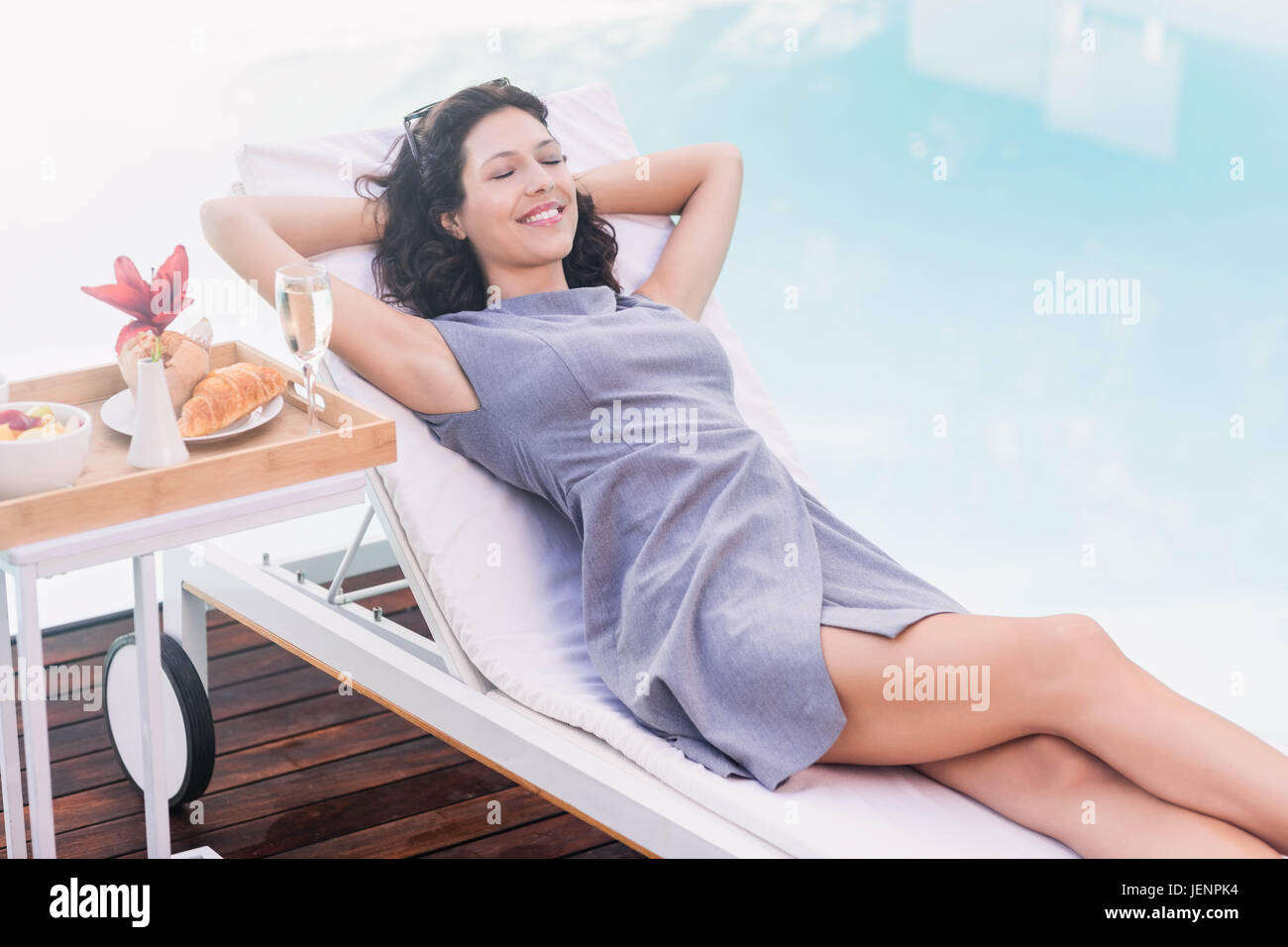 Woman lying on sun lounger hi-res stock photography and images - Alamy