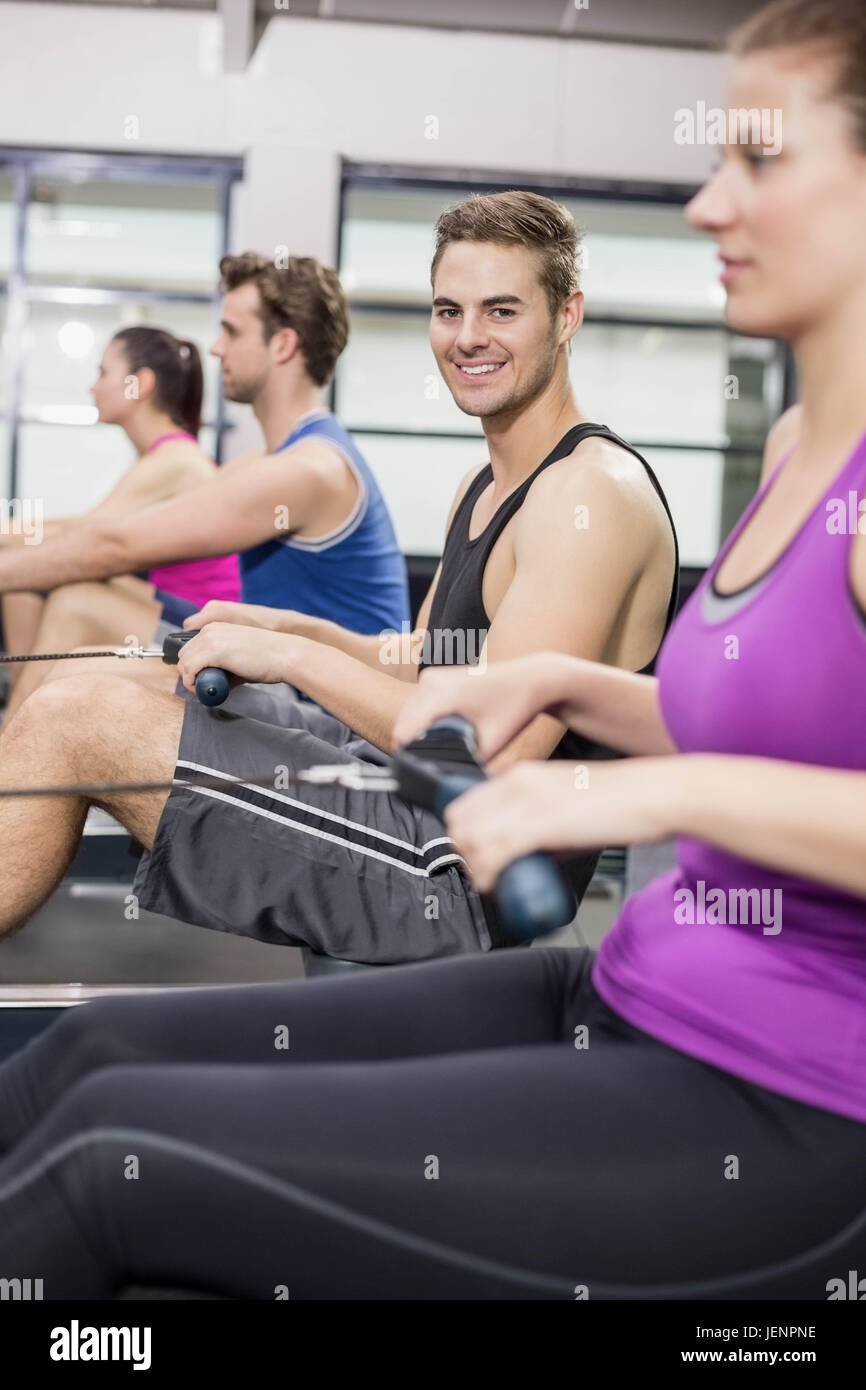 Fit people on drawing machine Stock Photo - Alamy
