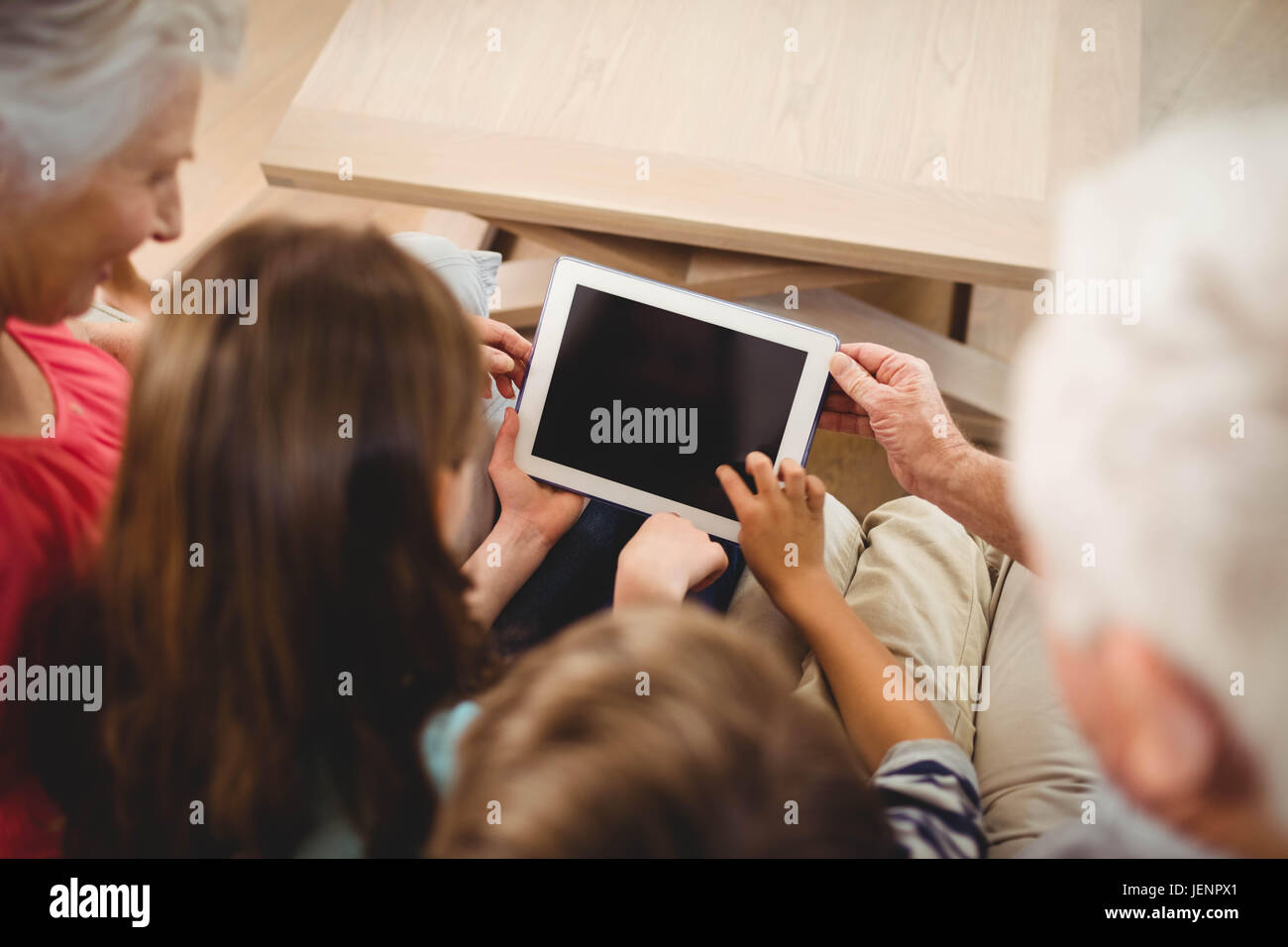 Children use tablet hi-res stock photography and images - Alamy