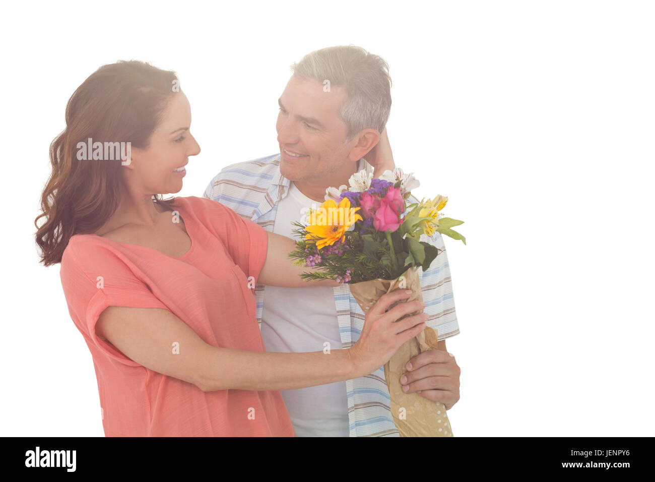 Couple with flowers bouquet Stock Photo - Alamy