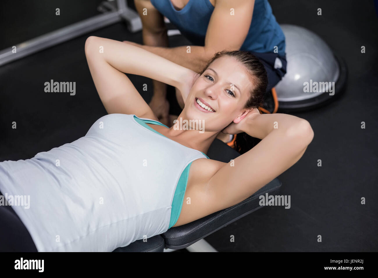 Pretty woman working her abs Stock Photo - Alamy
