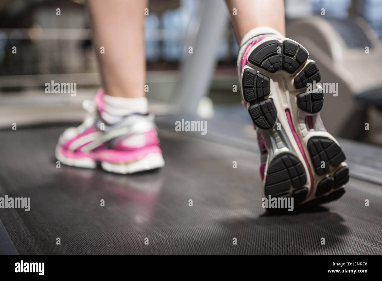 Feet of a woman on a treadmill Stock Photo - Alamy