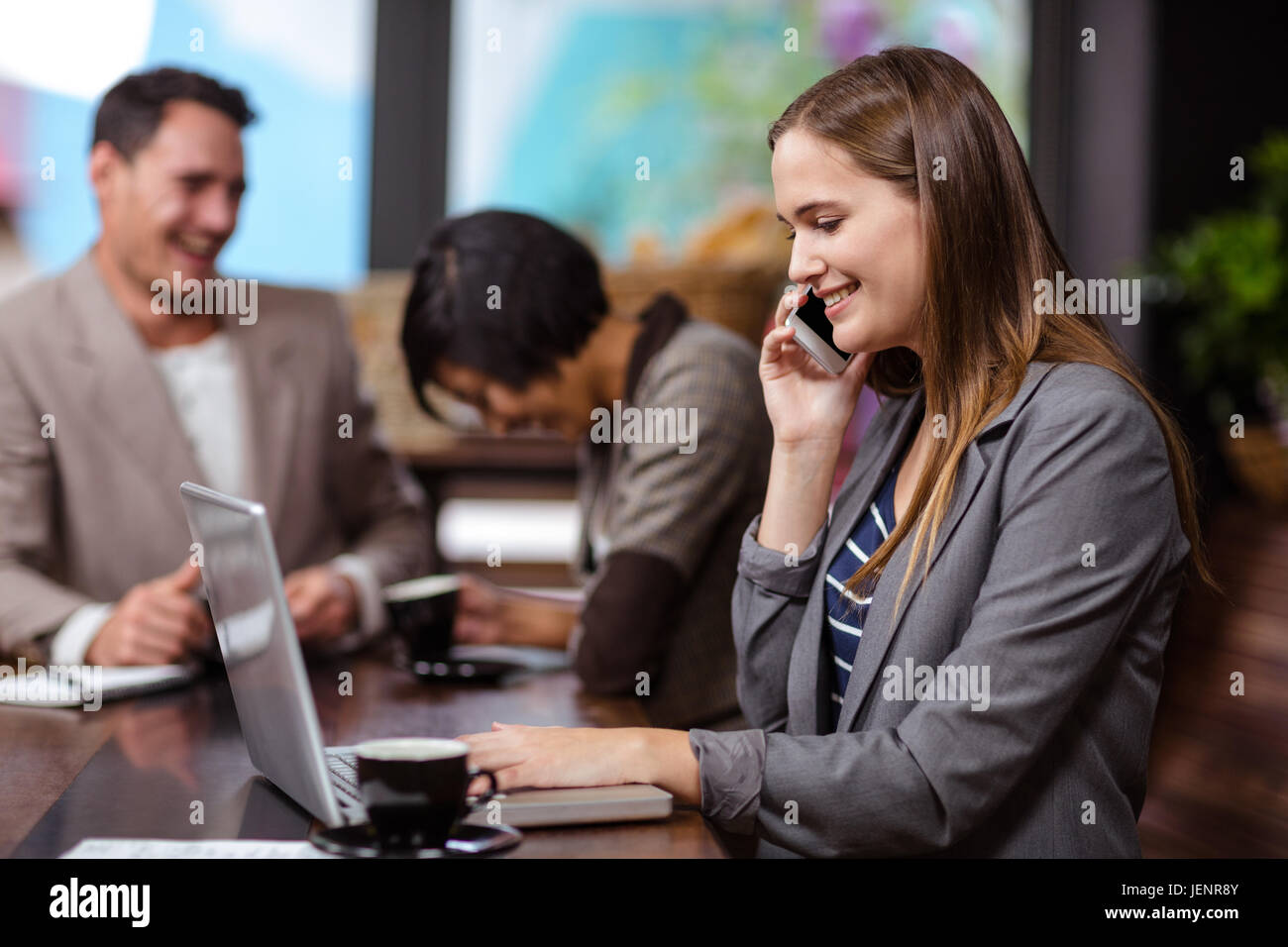 Woman using technology Stock Photo - Alamy