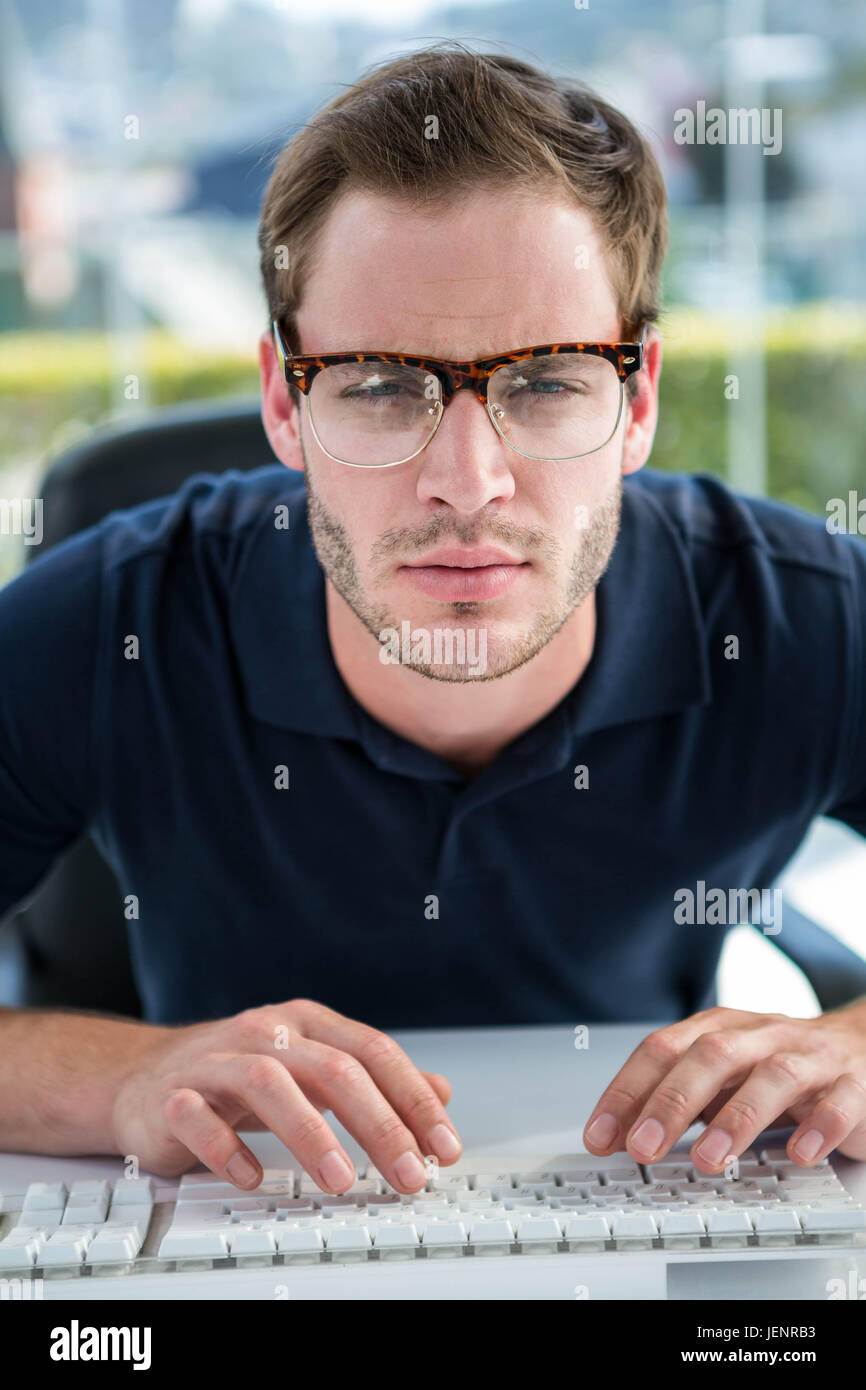 Handsome man using computer Stock Photo - Alamy