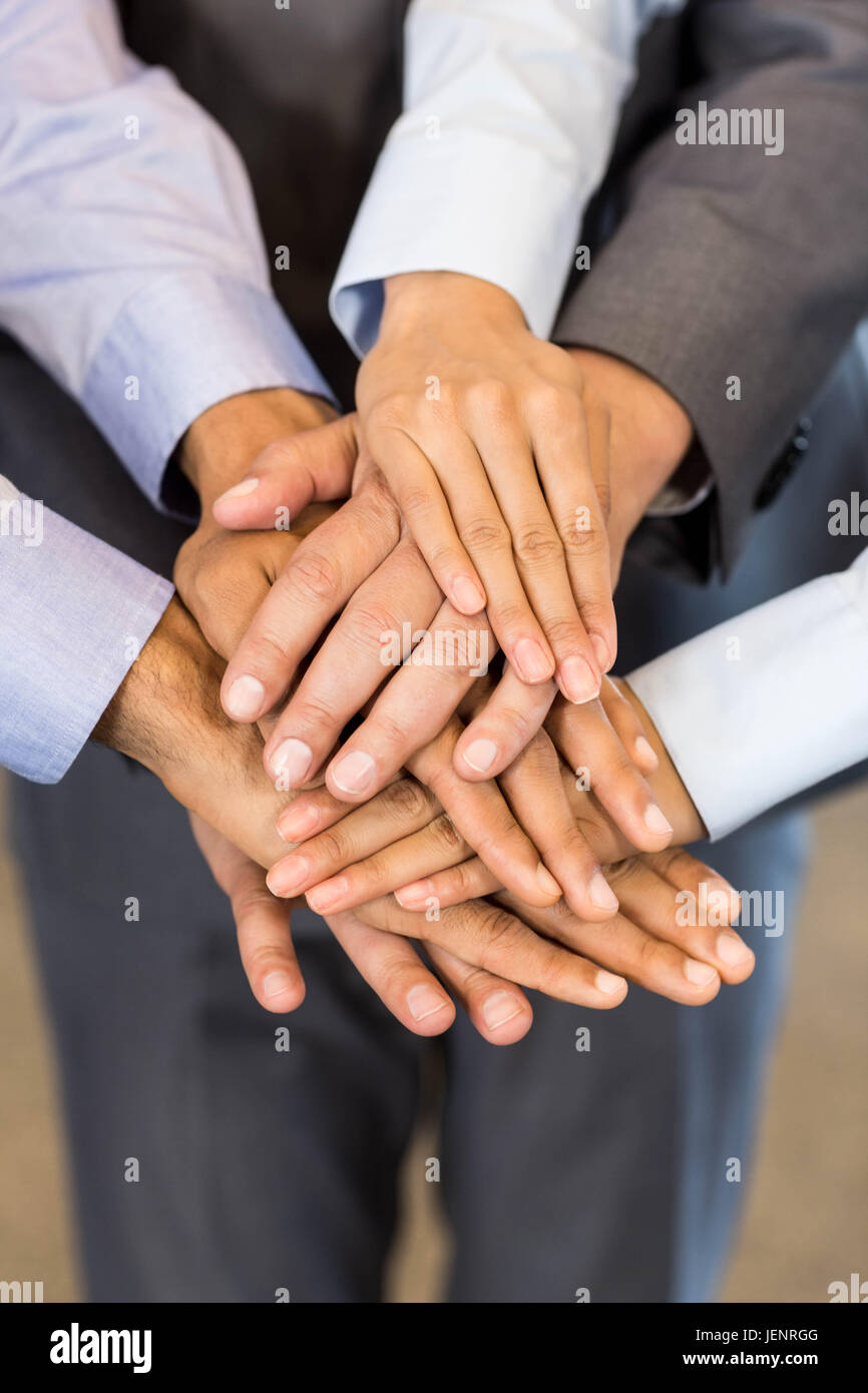 Businesspeople stacking hands hi-res stock photography and images - Alamy
