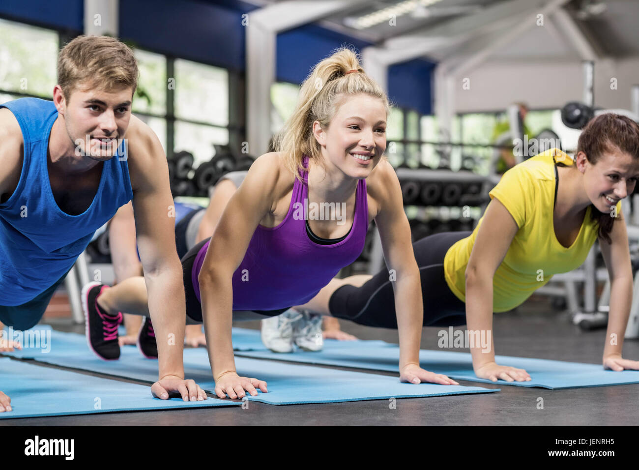 Fit people in plank position Stock Photo - Alamy
