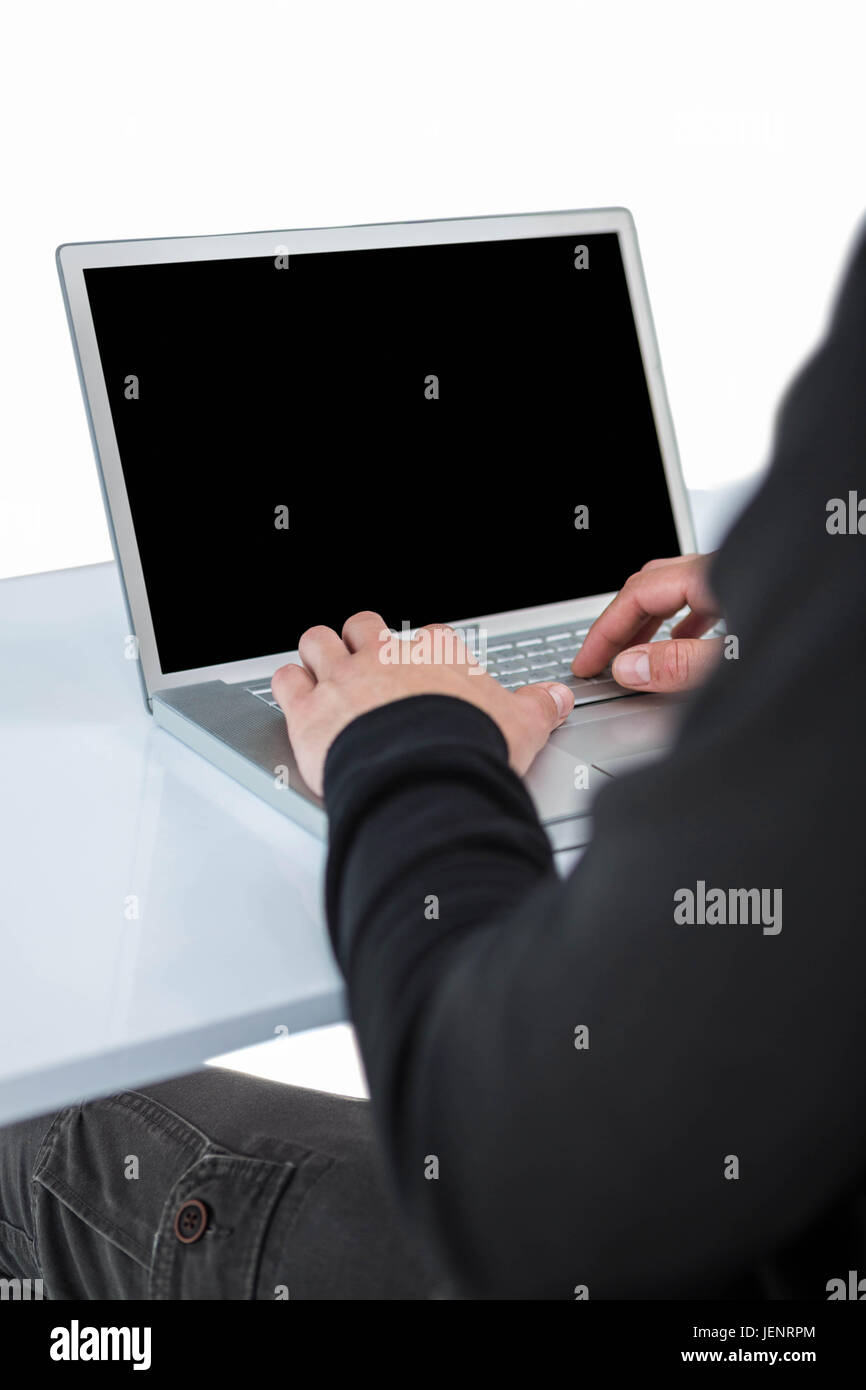 Young man laptop hoodie hi-res stock photography and images - Alamy