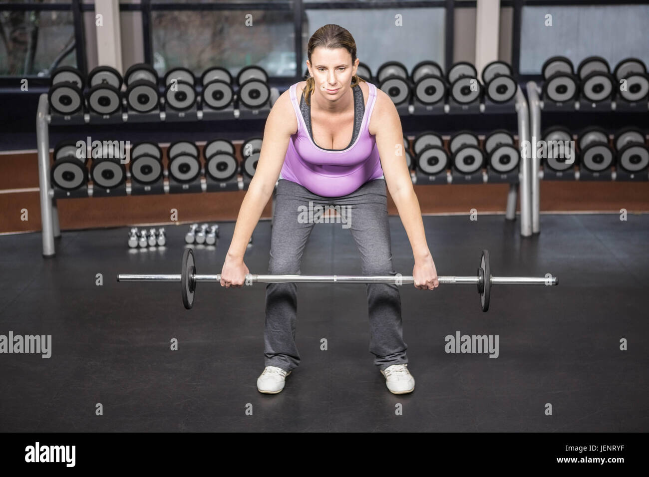 Pretty woman lifting barbell hi-res stock photography and images - Alamy