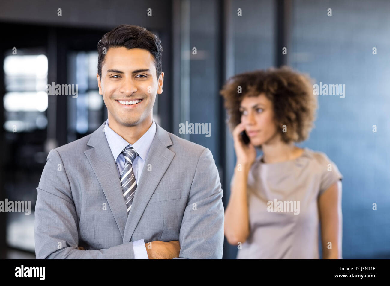 Good looking businessman posing Stock Photo - Alamy