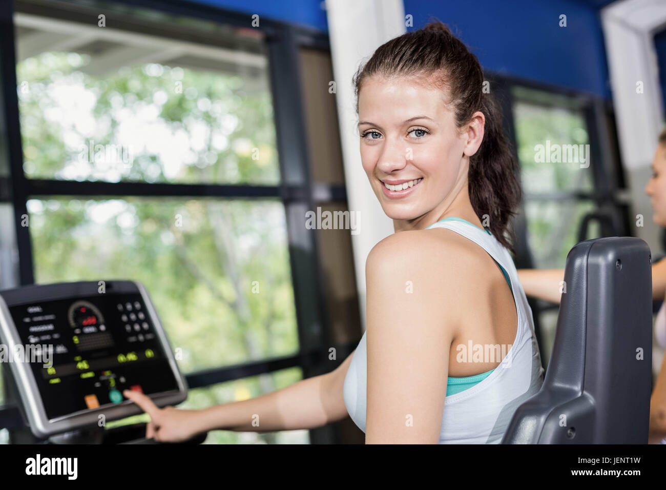 Fit woman doing exercise bike Stock Photo - Alamy