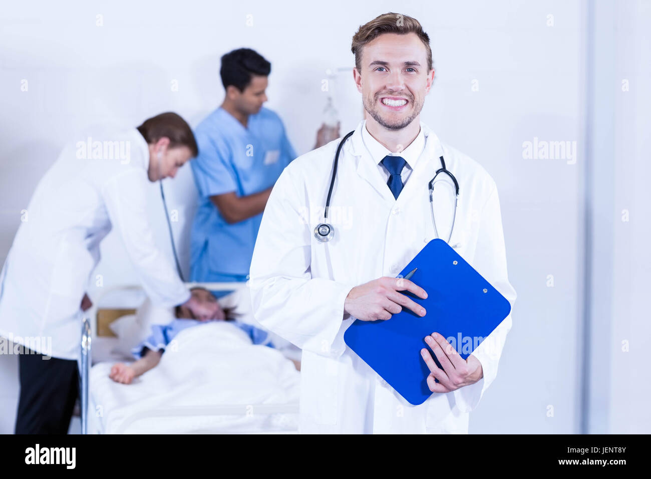 Portrait of doctor holding clipboard Stock Photo - Alamy