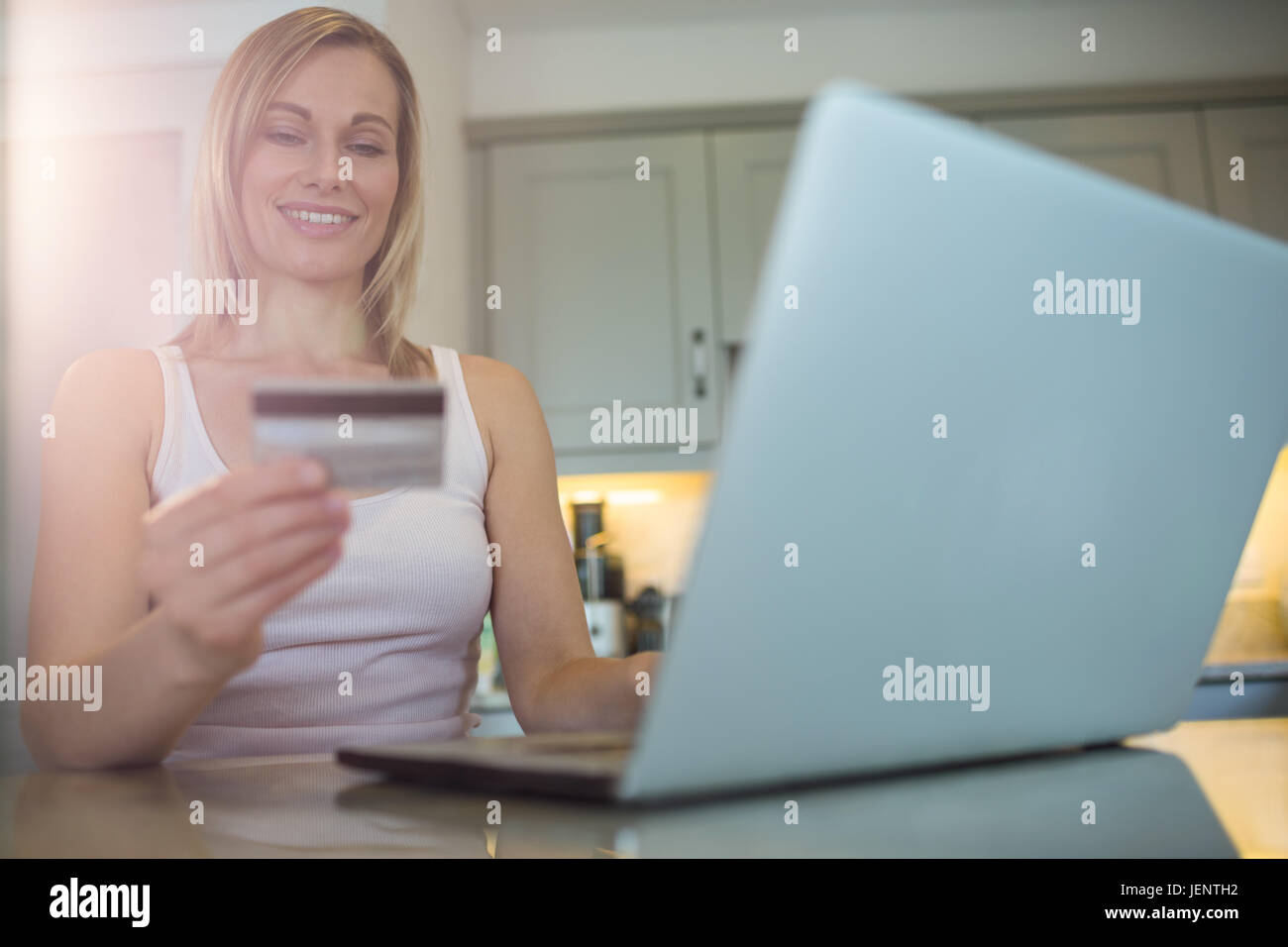 Pretty blonde woman ordering online Stock Photo - Alamy