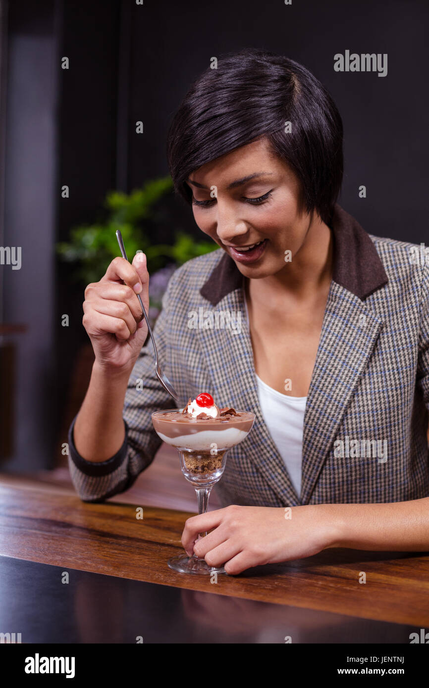 Pretty woman about to eat dessert Stock Photo - Alamy