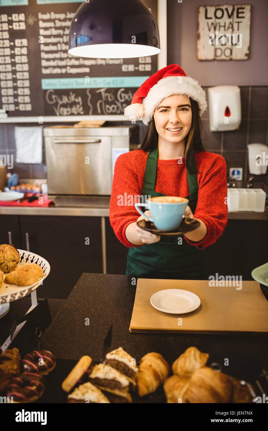 Cute waitress giving a coffee to customer Stock Photo - Alamy