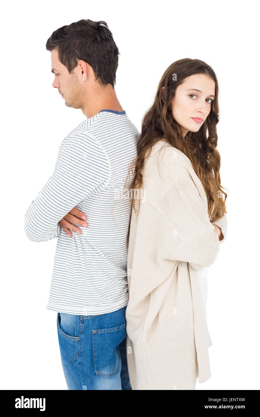 Couple standing back to back Stock Photo - Alamy