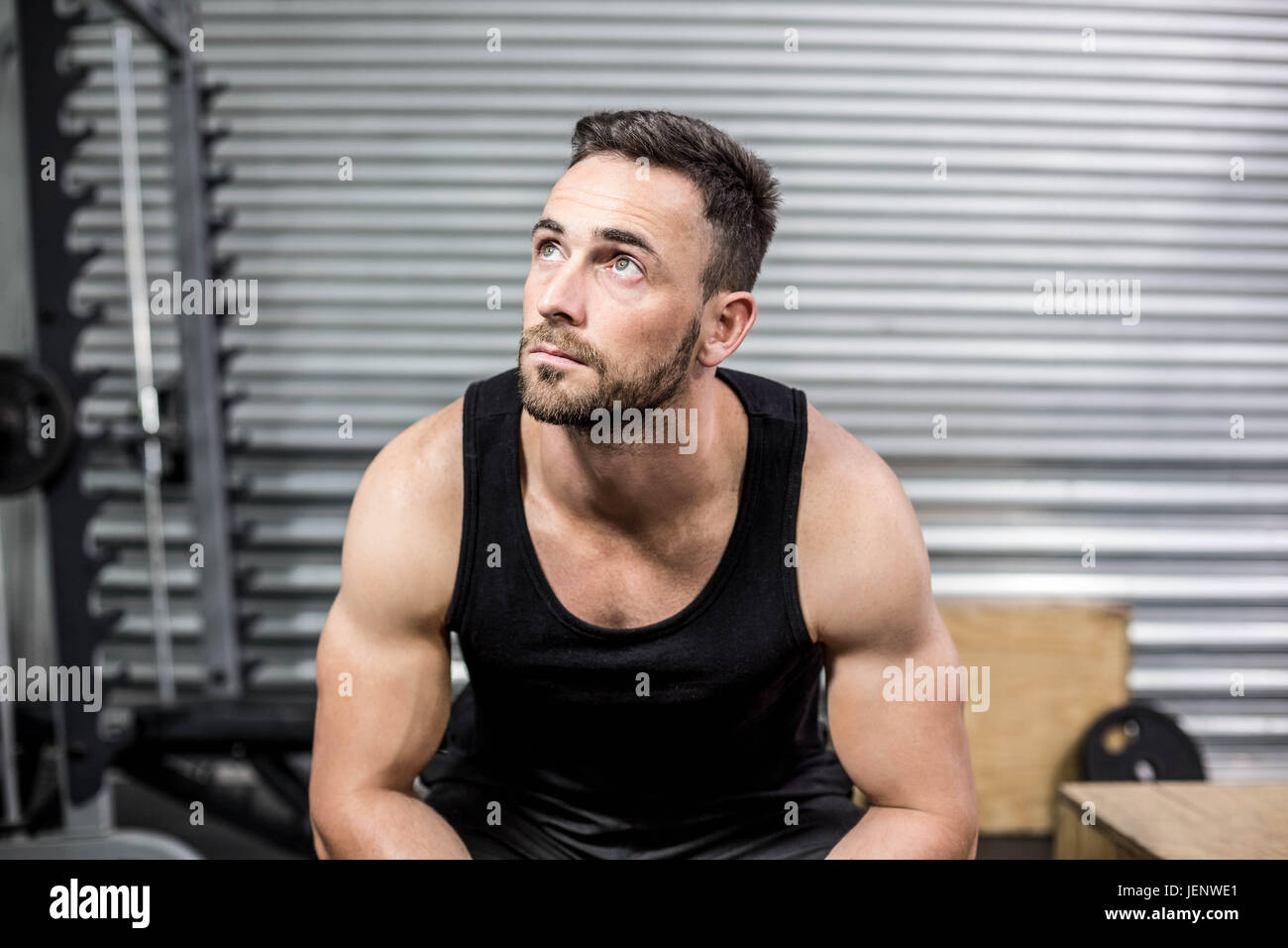 Thoughtful male athlete sitting hi-res stock photography and images - Alamy
