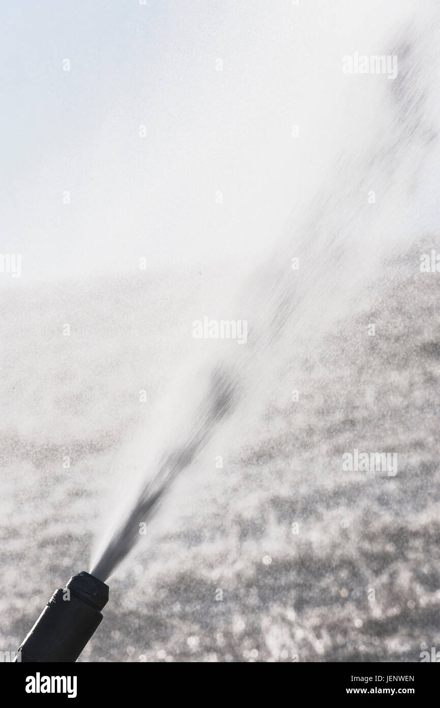 Water flowing through hose Stock Photo - Alamy