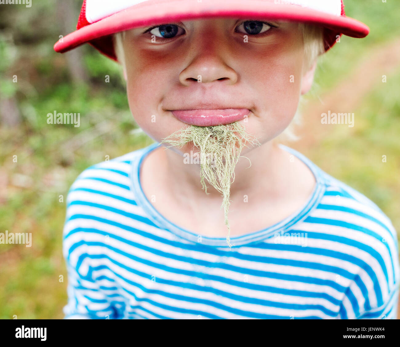 Boy with grass beard Stock Photo - Alamy