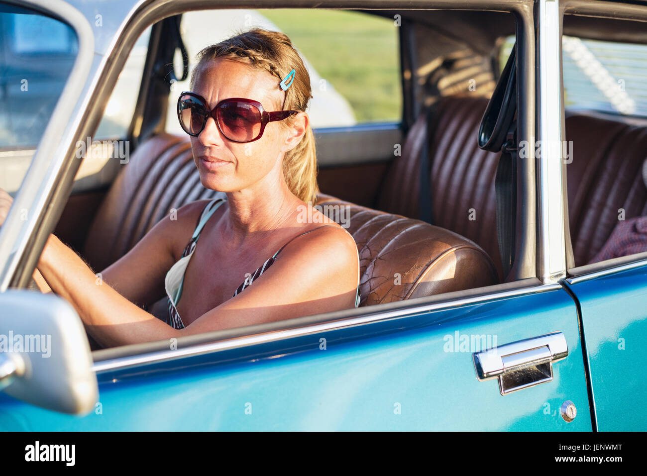 Woman in vintage car Stock Photo - Alamy