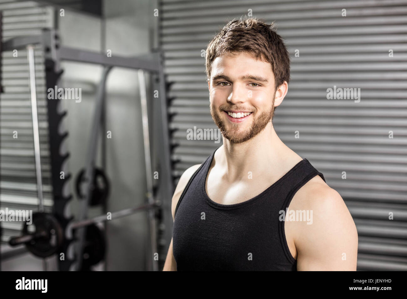 Smiling fit man posing Stock Photo - Alamy