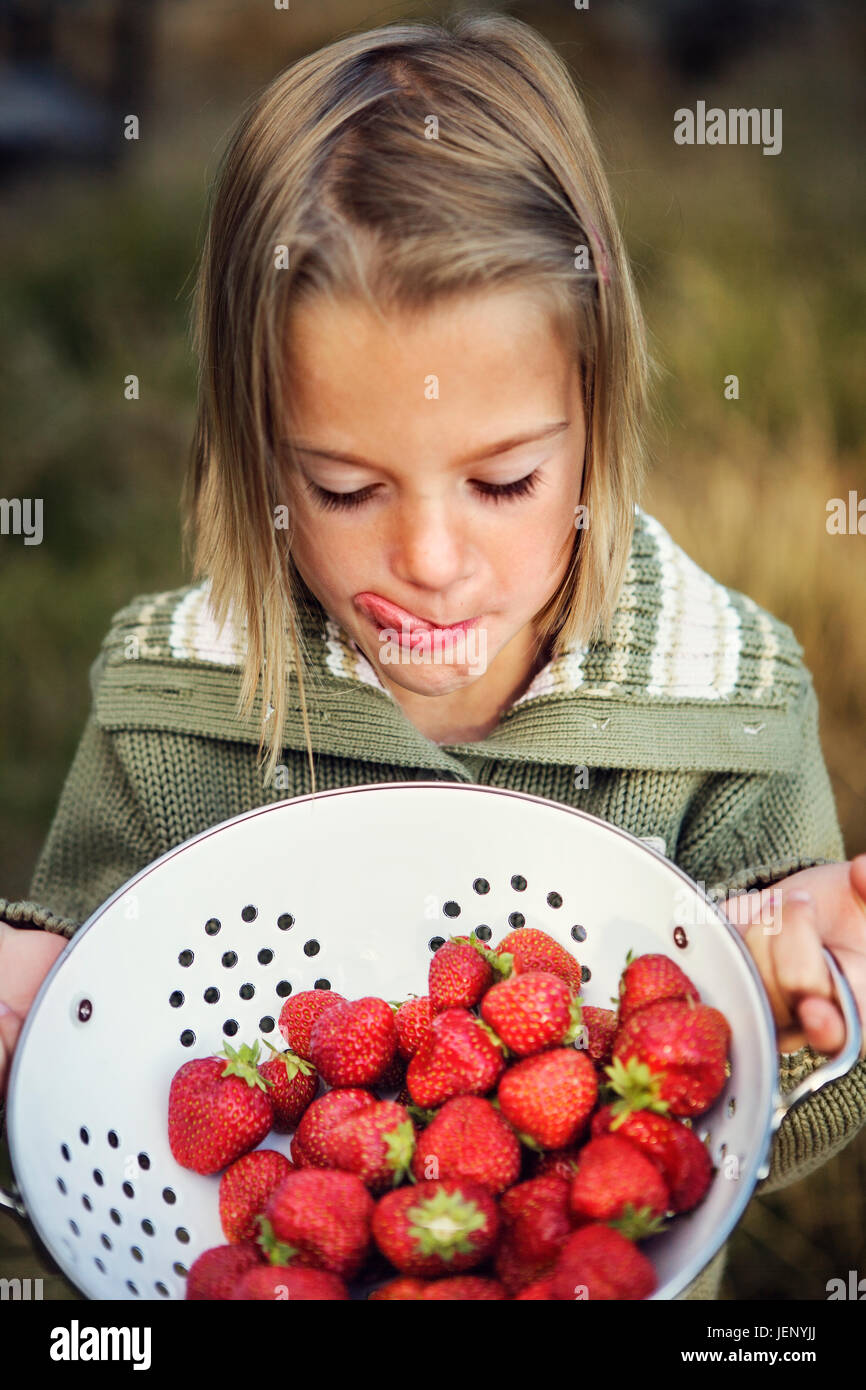 Girl with strawberries Stock Photo - Alamy