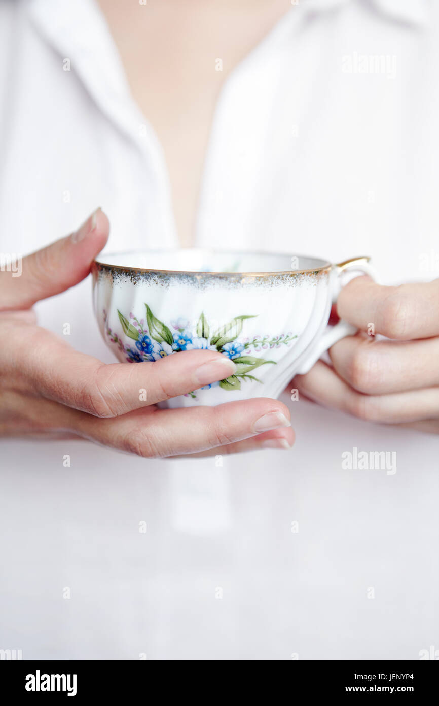 Hands holding cup Stock Photo - Alamy