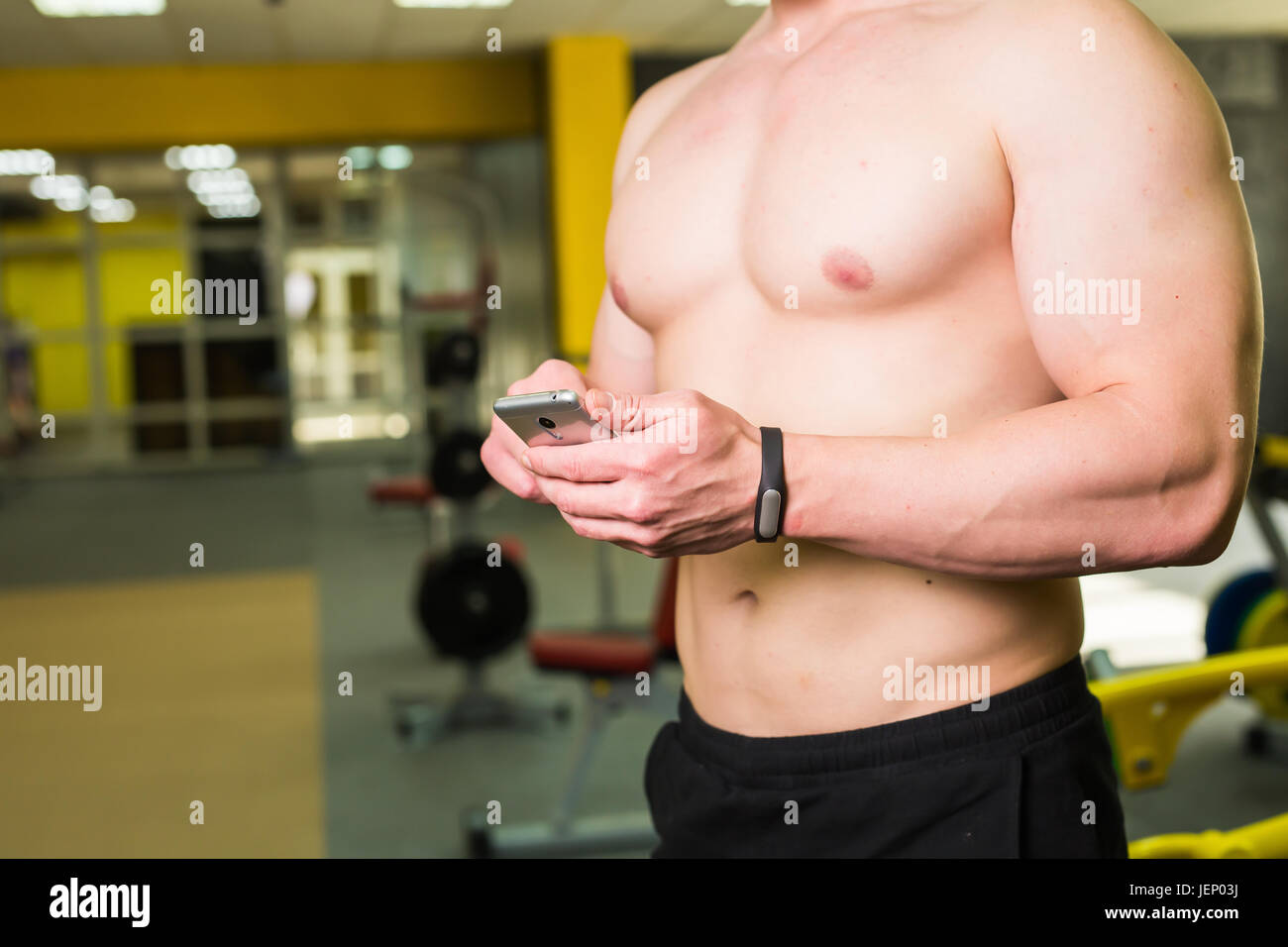 Close-up of Sportive Man After Workout Session Checks Fitness Results Smartphone. Adult Guy ...