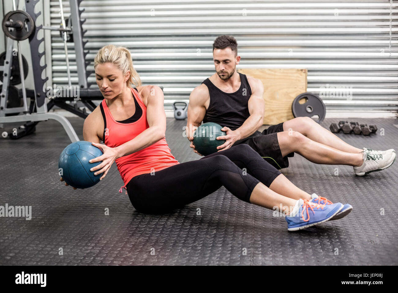 Fit couple doing abdominal ball exercise Stock Photo - Alamy